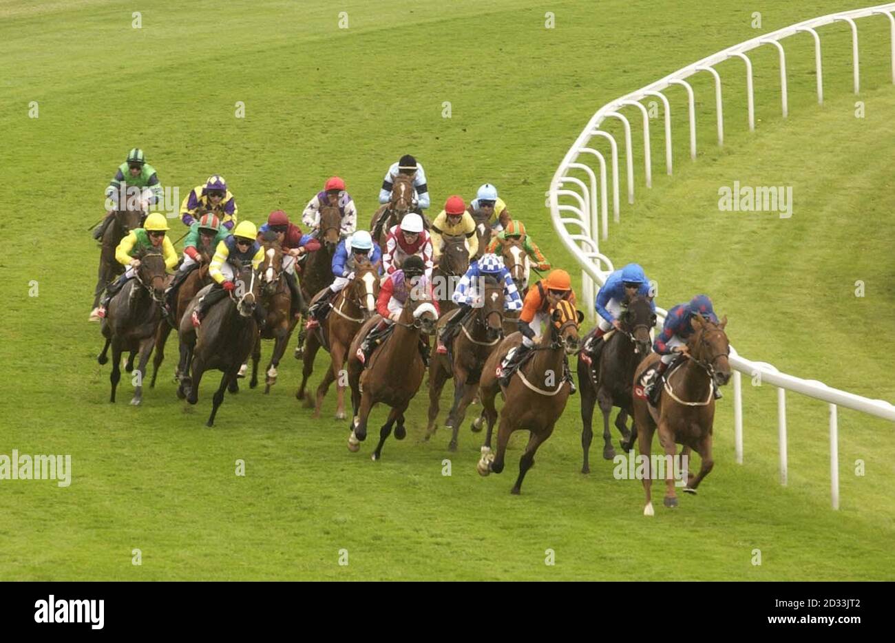 Darryl Holland riding Mystical Girl leads the field at Tattenham Corner ...