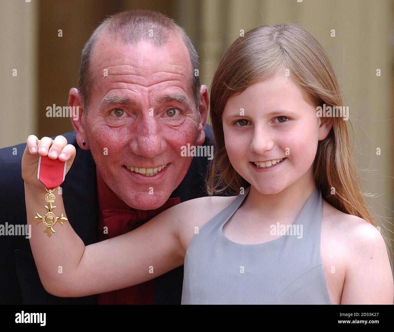Pete Postlethwaite and daughter Lilly, 8, with his OBE for services to ...