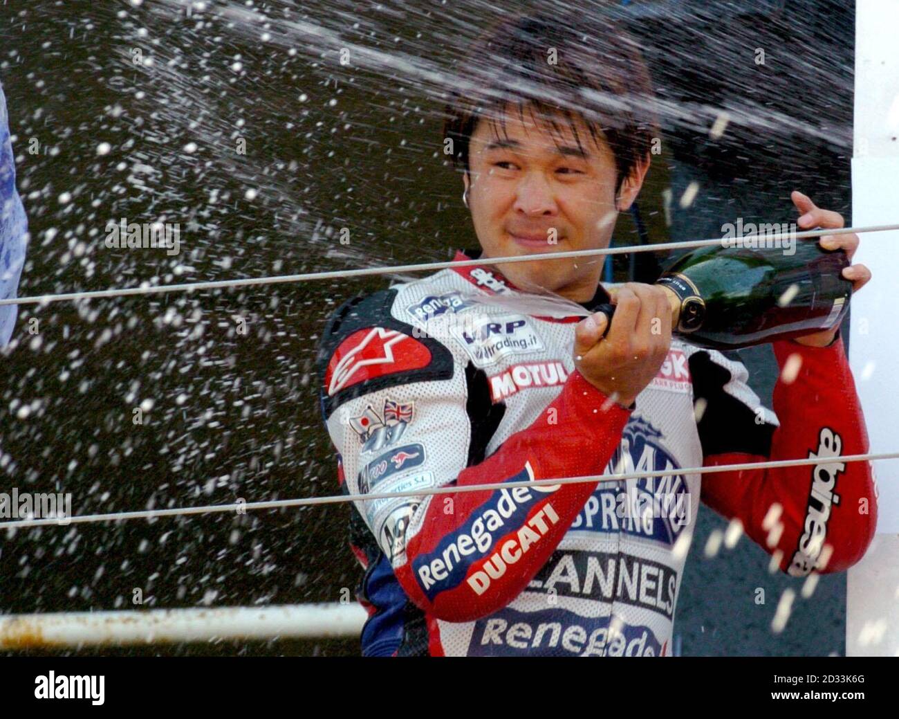 Noriyuki Haga on his Ducati 999RS waves to the crowd from Luffield ...