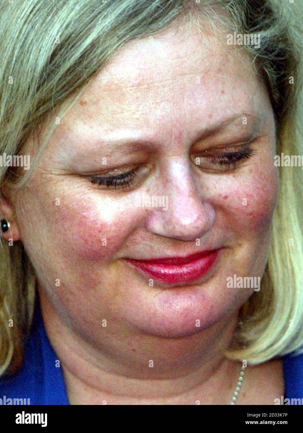 Sue Dickinson shows the strain as she gives a press conference outside ...