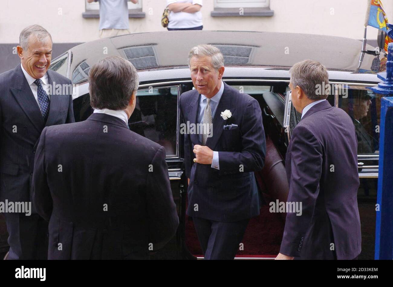 The Prince of Wales (centre) is greeted by the Bailiff of Jersey Sir ...