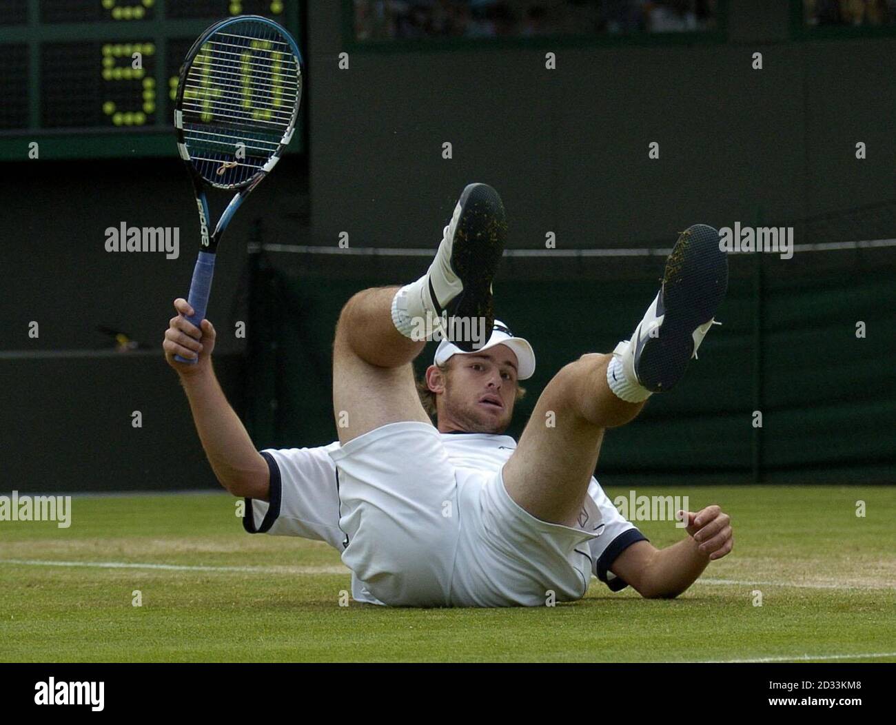 Andy Roddick from the USA makes a rare stumble during his straight sets ...