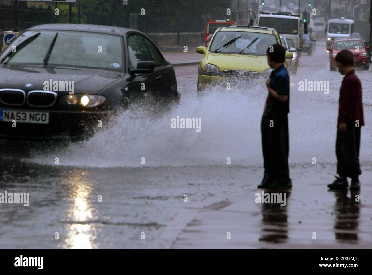 Vehicles drive through heavy rain in Newcastle upon Tyne, as heavy ...