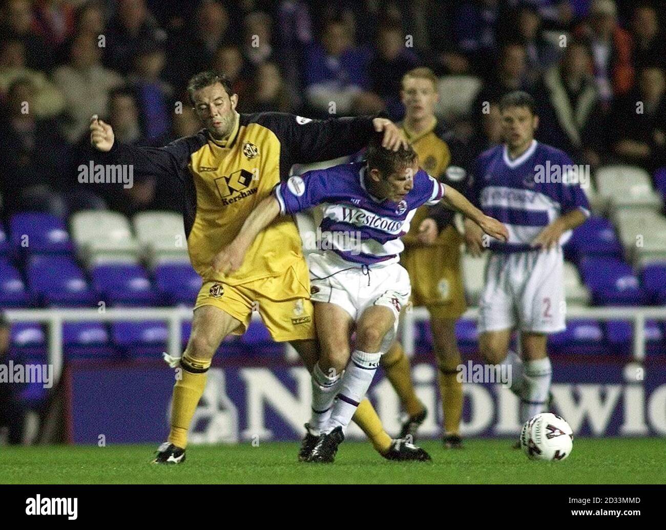 Reading's Phil Parkinson is tackled by Ian Ashbee (left) of Cambridge ...