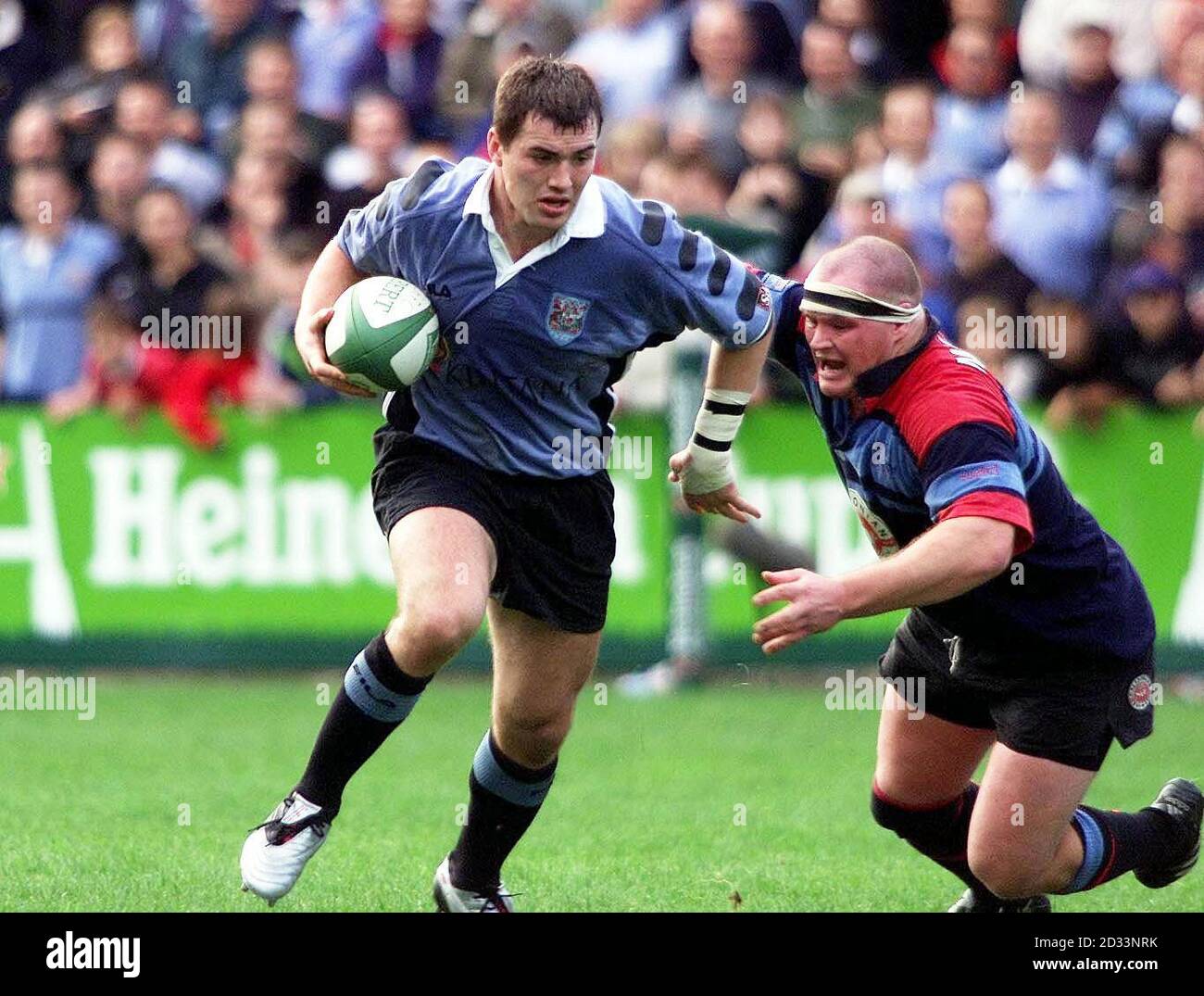Iestyn Harris of Cardiff (left) slips the tackle of Glasgow's Gordon ...