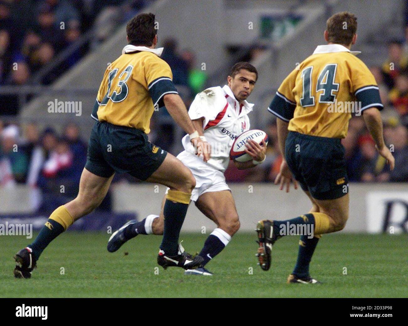 England's Jason Robinson (centre) is closed down by Australia's Nathan ...