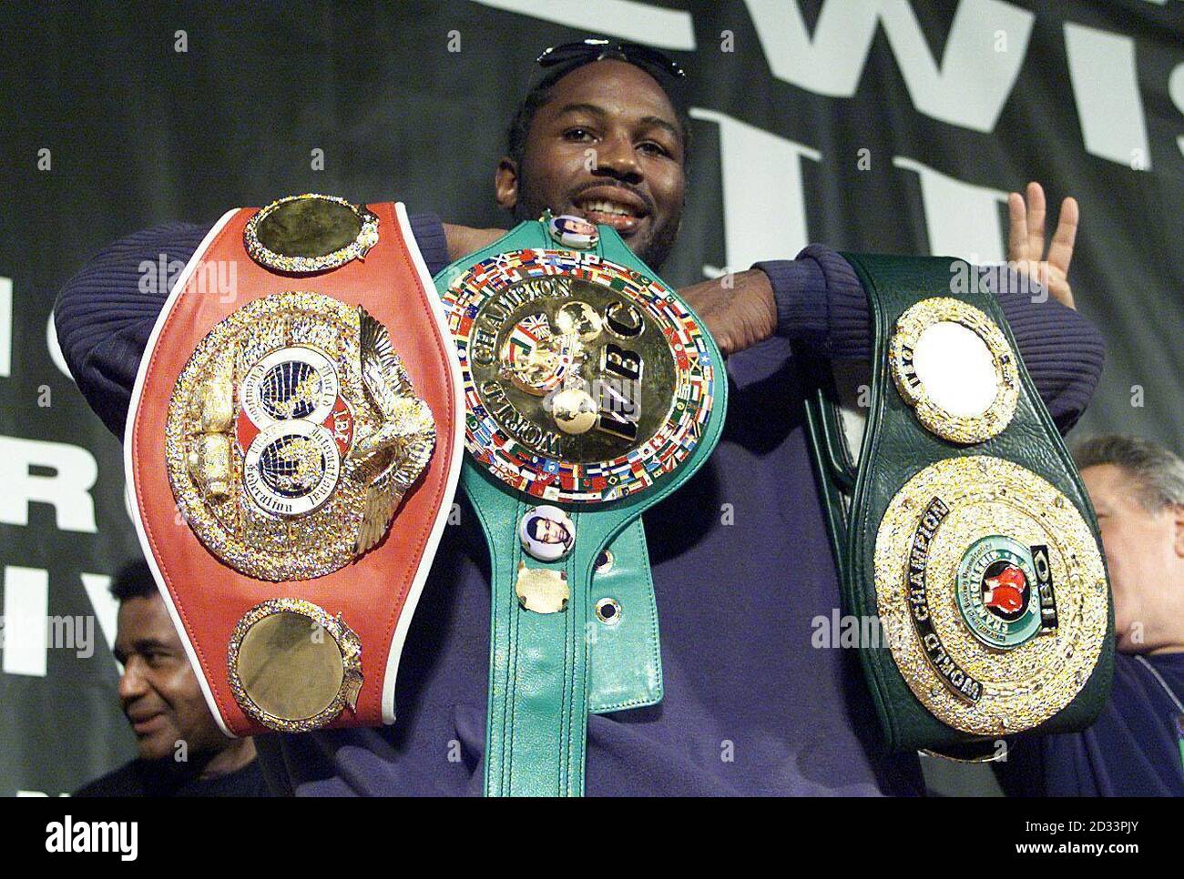 Great Britain's new heavyweight boxing champion Lennox Lewis holds up ...