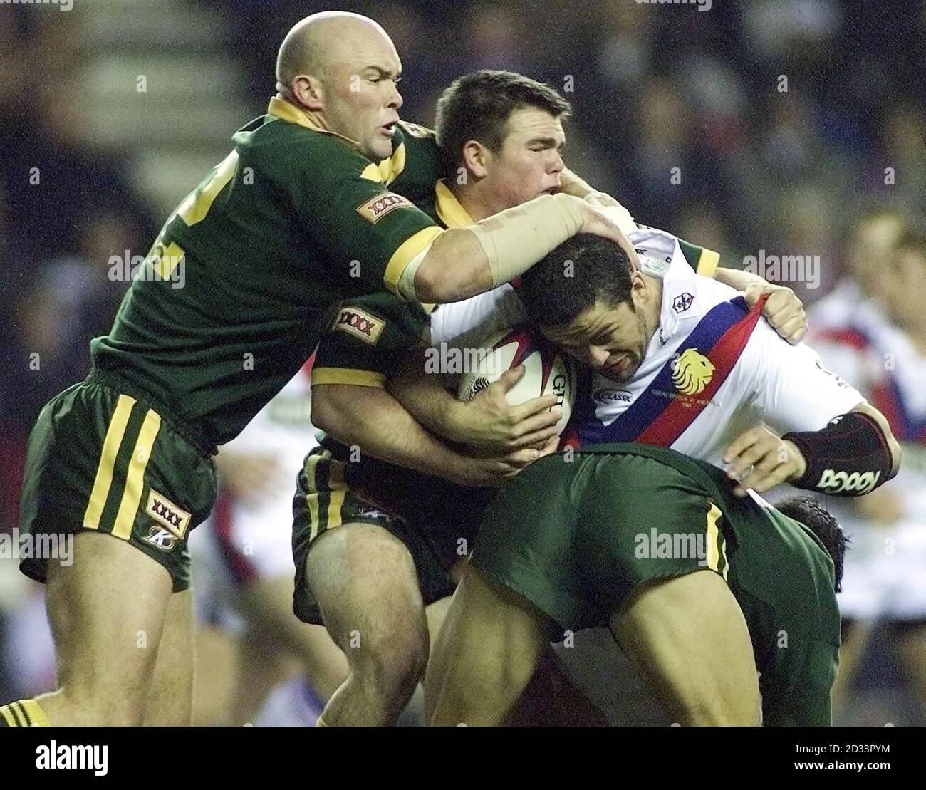 Great Britain's Andrew Farrell is tackled by (left to right) Australia ...