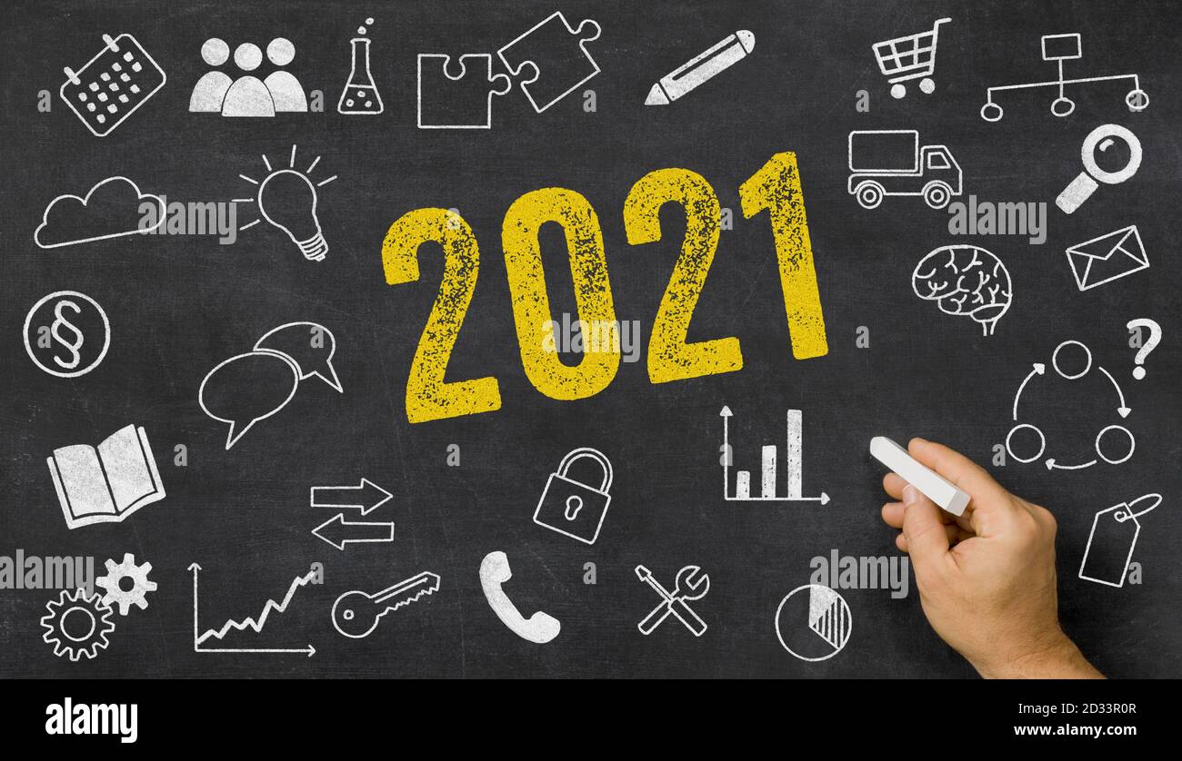 2021 written on a blackboard with icons Stock Photo - Alamy