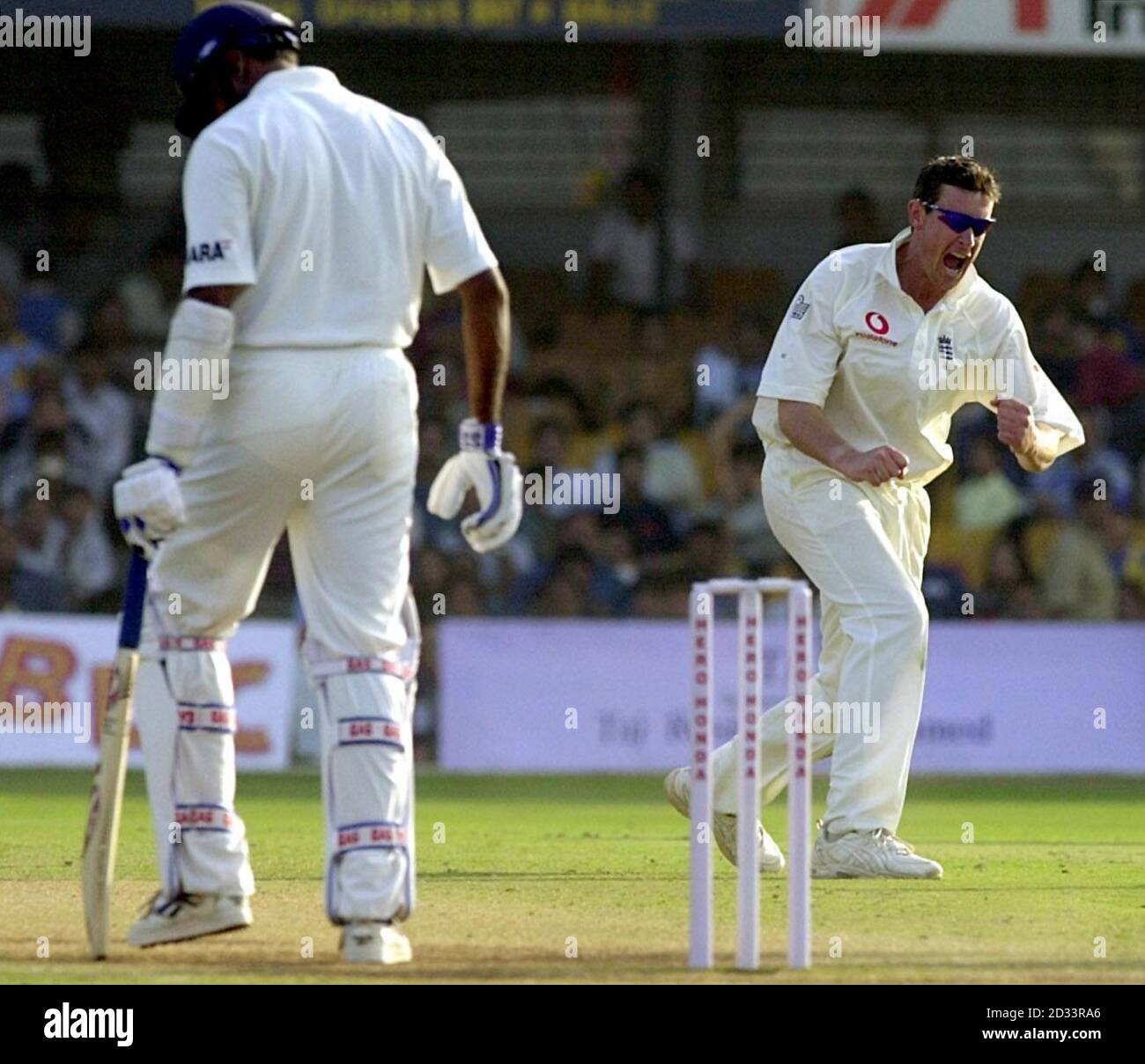 England bowler Ashley Giles (right) celebrates the dismissal of India's ...