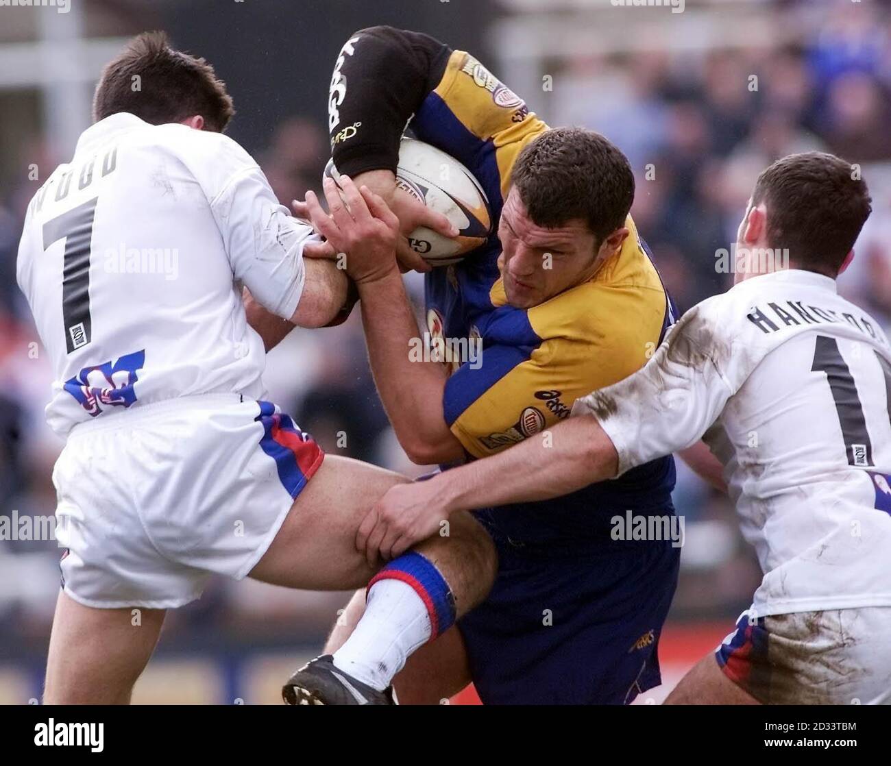 Leeds Rhinos's Barrie McDermott is tackled by Wakefield Trinity ...