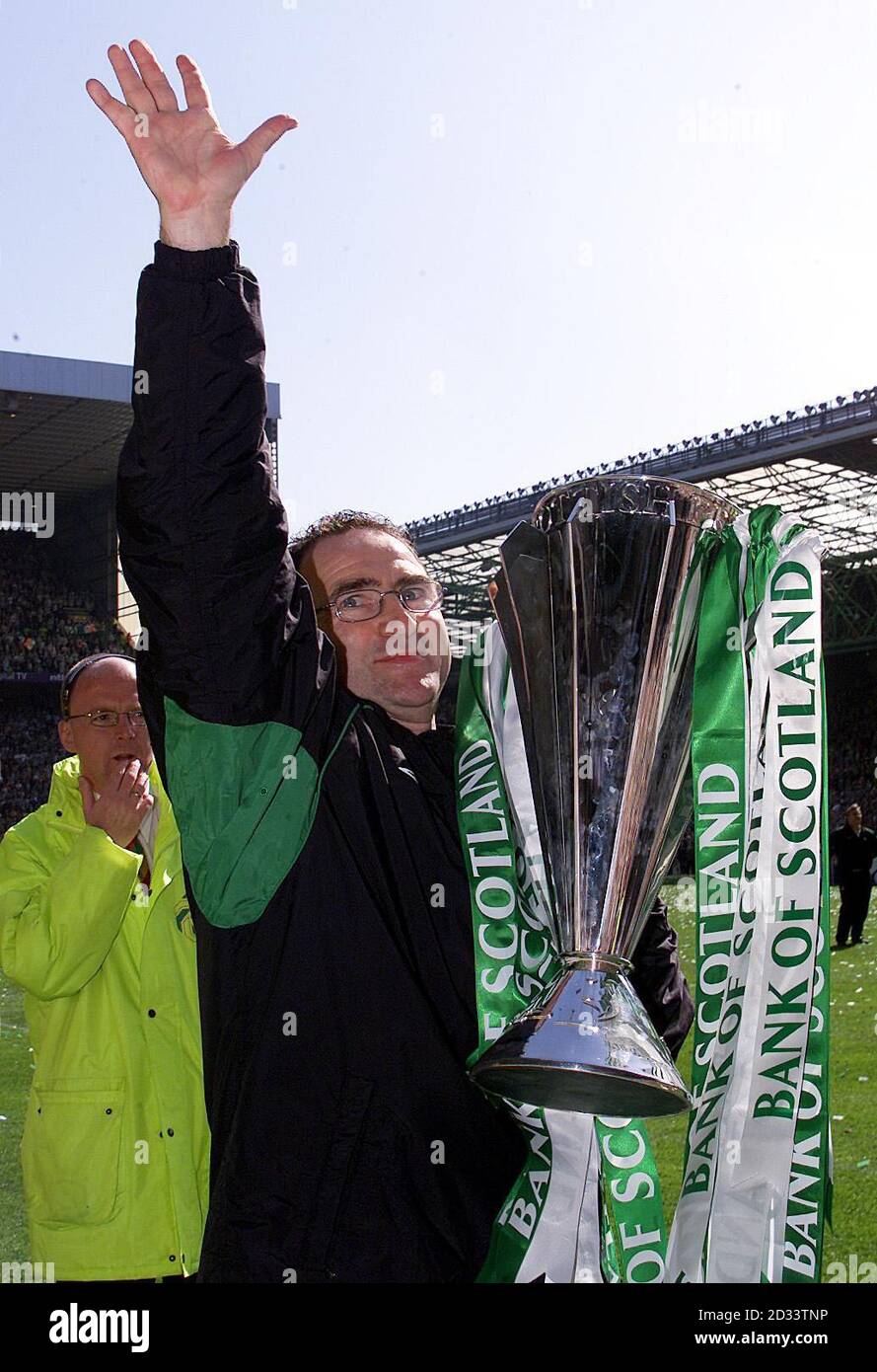 Celtic Manager Martin O'Neill waves to fans as he holds the SPL trophy ...