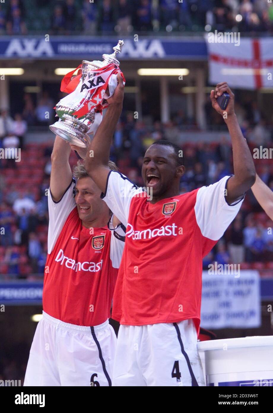 Arsenal captain Tony Adams (left) and team-mate Patrick Vieira lift the ...
