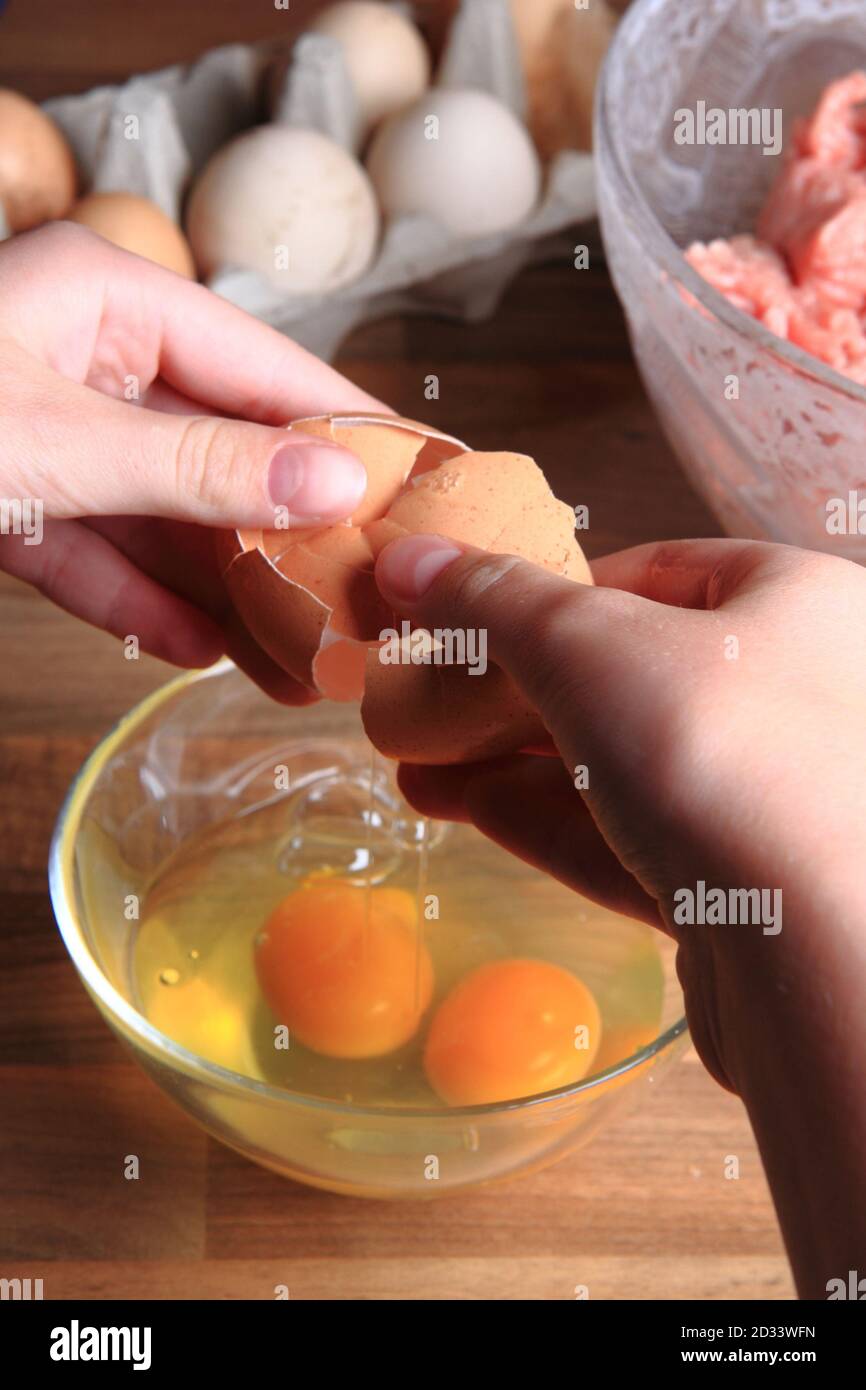 eggs in human hands - food preparation background Stock Photo - Alamy