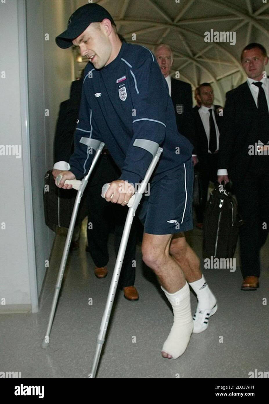 England's Danny Murphy hobbles through Kansi International airport ...