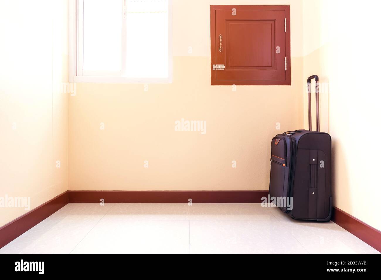 Luggage trolley was placed in the corner of the room Stock Photo - Alamy