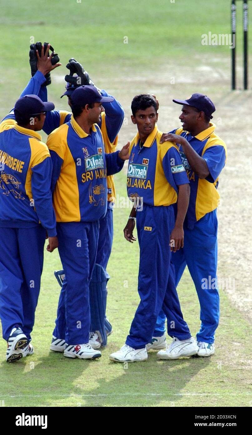 Sri Lanka's Upul Chandana (second right) looking on whilst team-mates ...