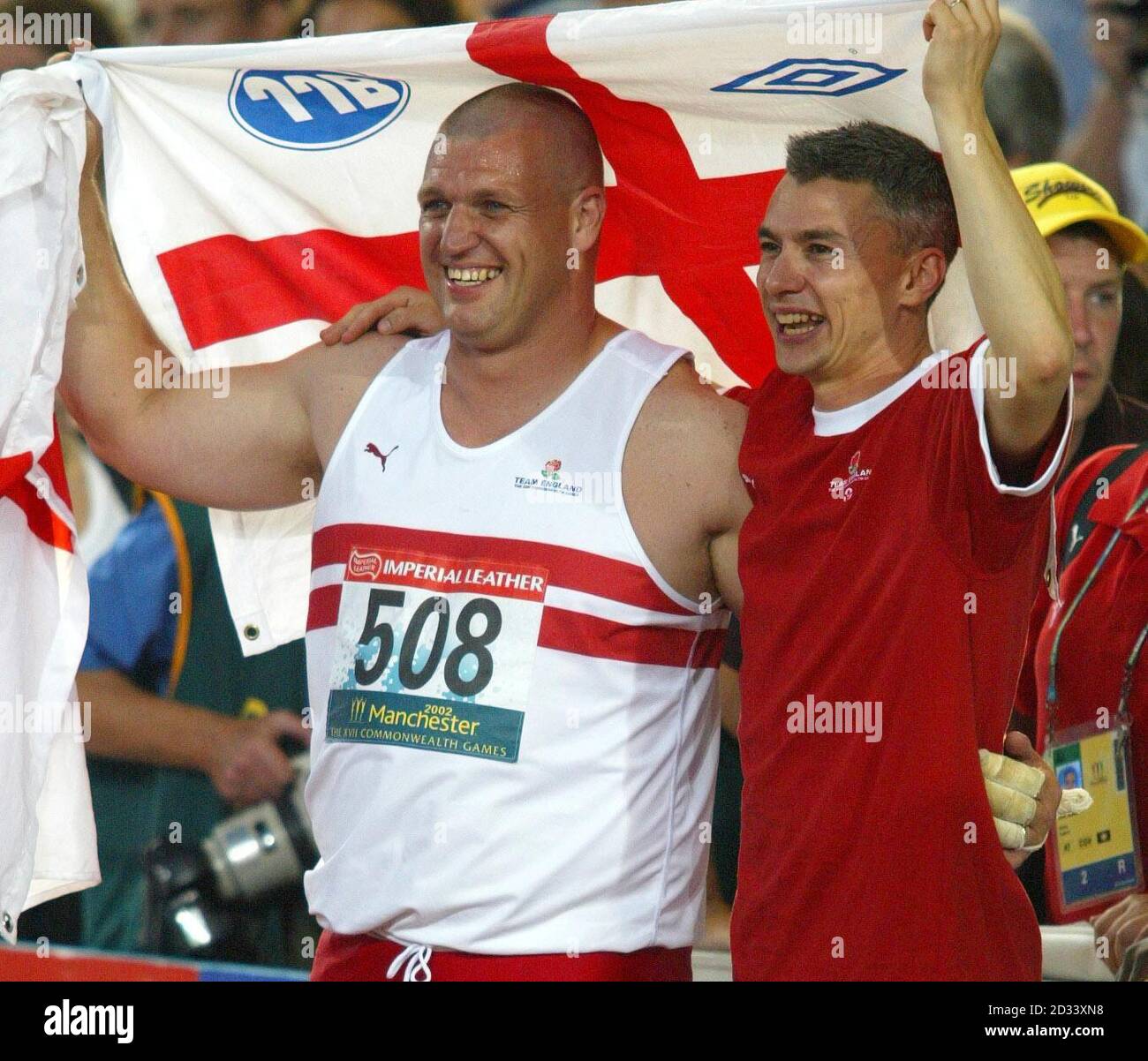 England gold medallists, Jonathan Edwards (left) in the triple jump and ...