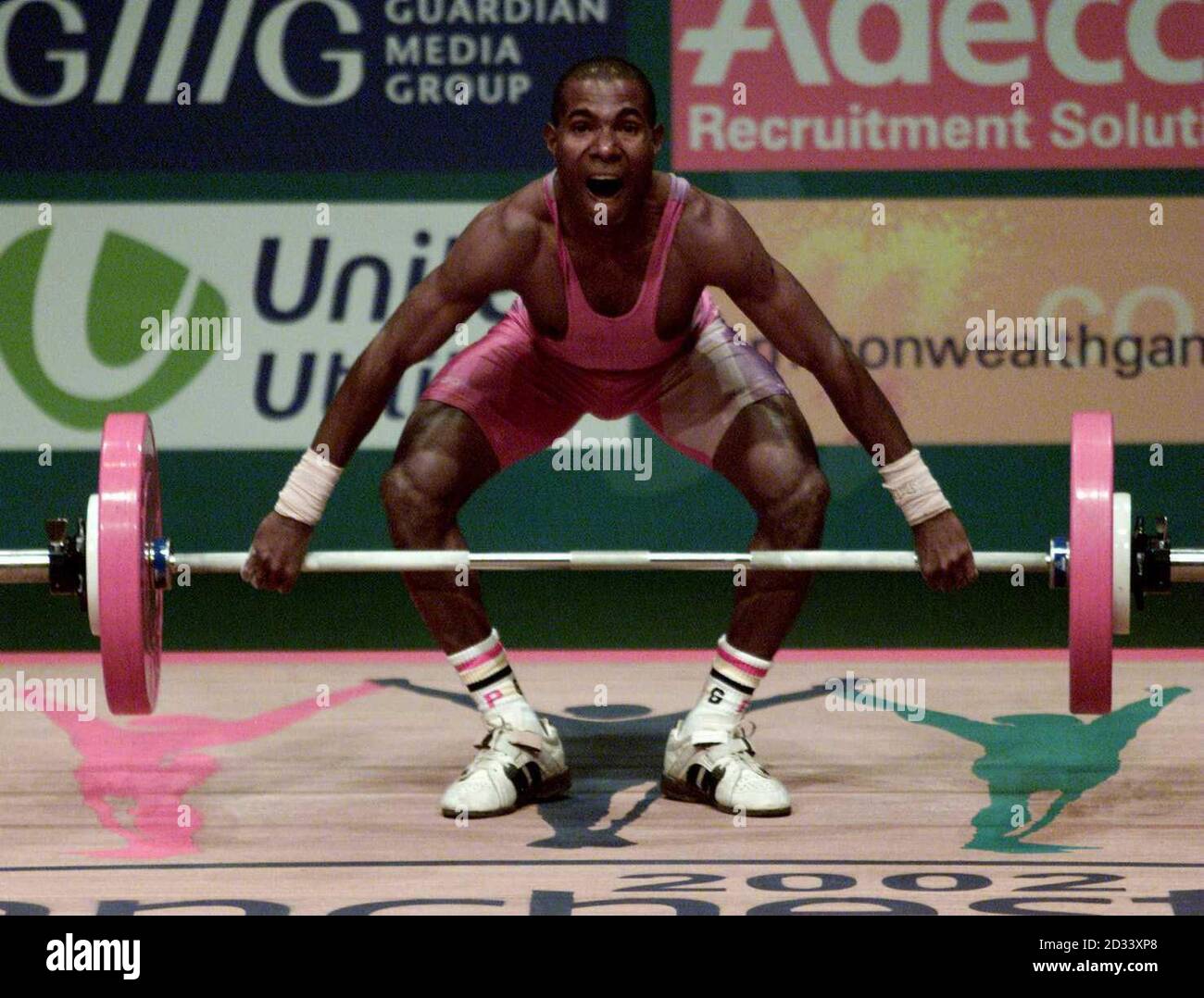 Papua New Guinea weightlifter Jeffery Robby marks a good lift during ...