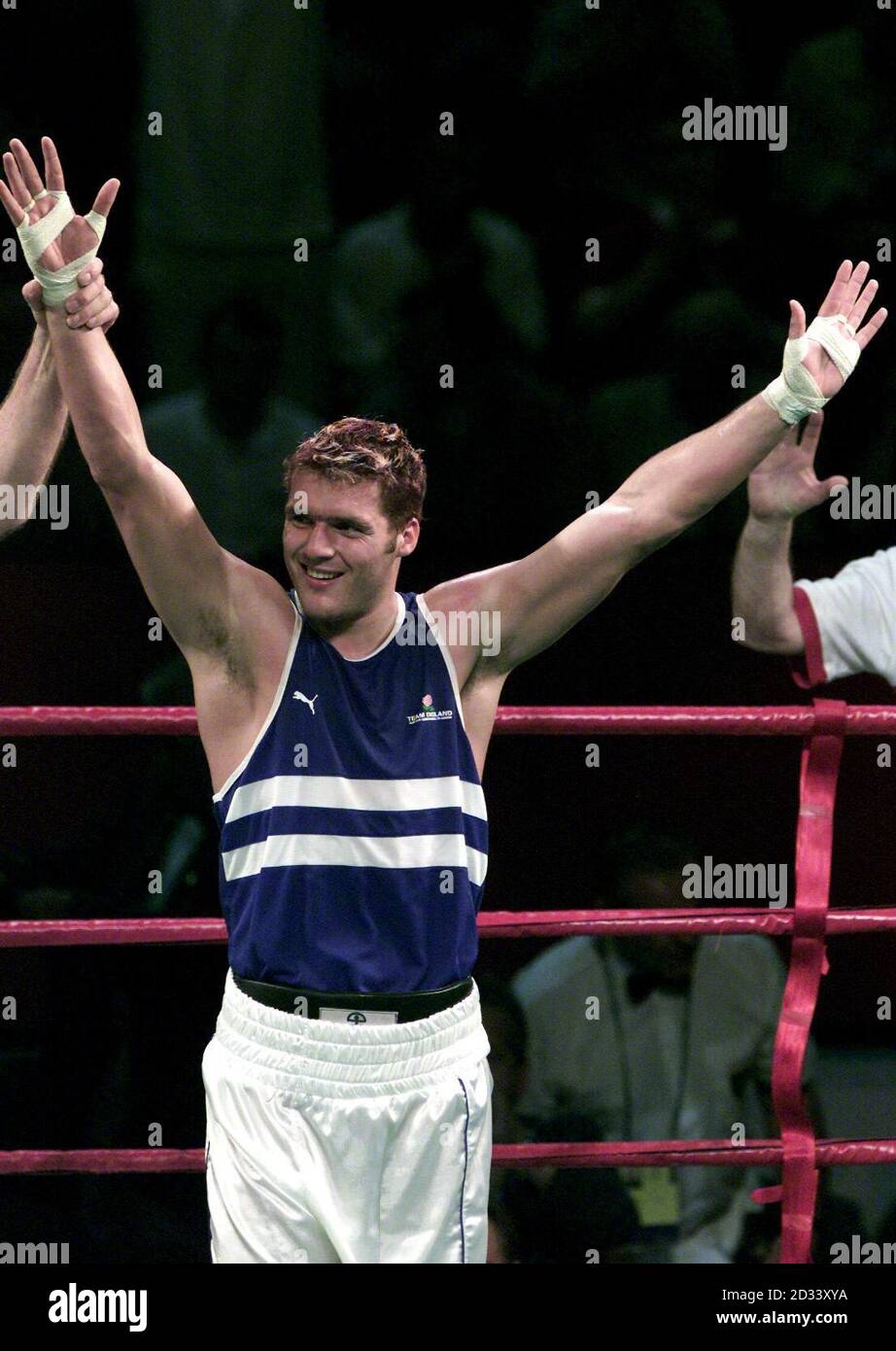 Boxing celebrating arms raised comgal hi-res stock photography and ...