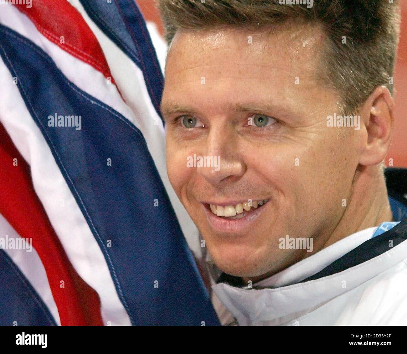 A delighted Steve Backley waves the Union Flag to supporters after ...
