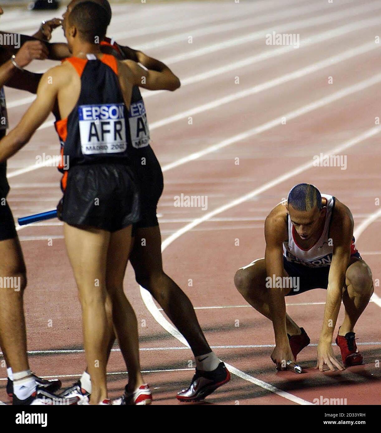 The African celebrates victory as Great Britain's Matt Elias who ran ...