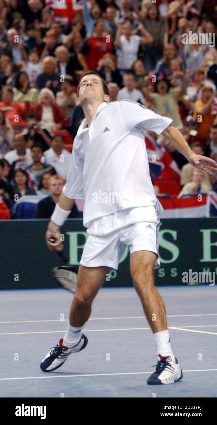 Great Britain's Tim Henman hurls his racket into the crowd after ...