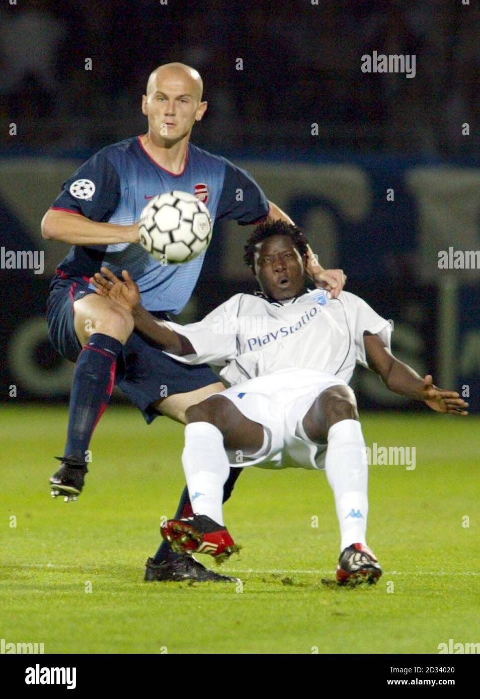 Arsenals pascal cygan auxerres benjani hi-res stock photography and ...