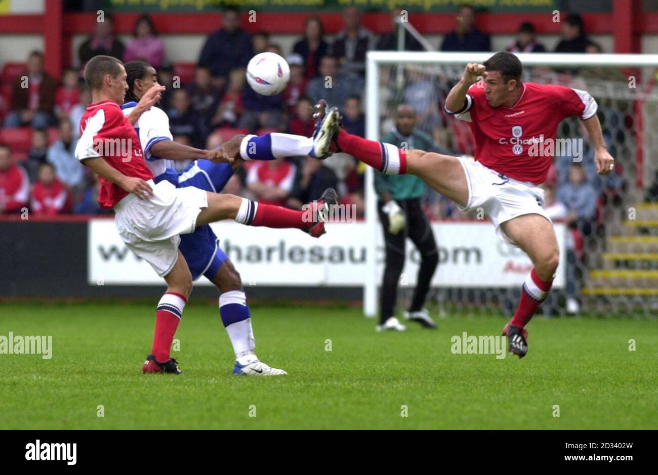 Crewe's Kenny Lunt and Dave Brammer (8) clash with QPR's Richard ...