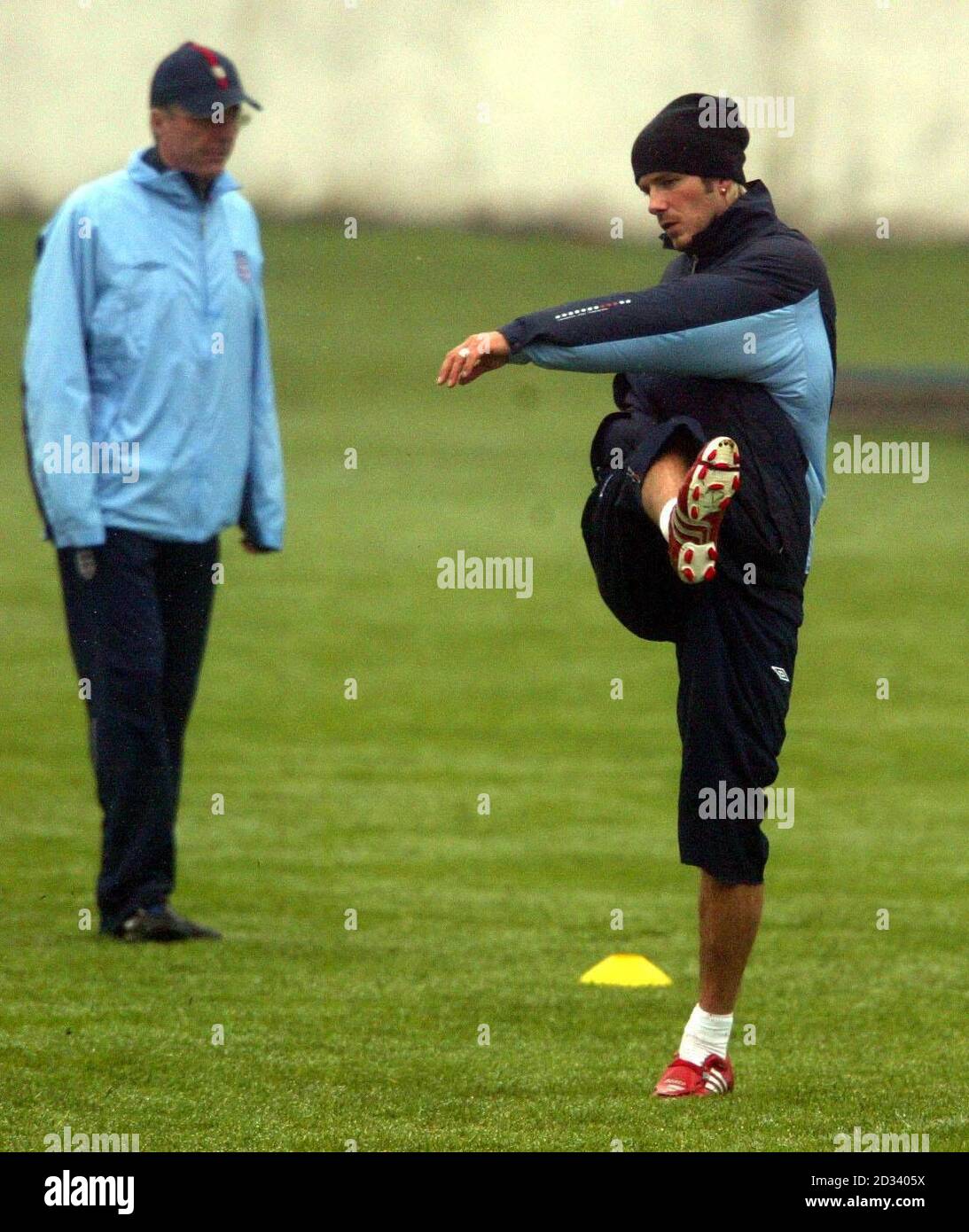 England's David Beckham (right) stretches in training at the Tehelne ...