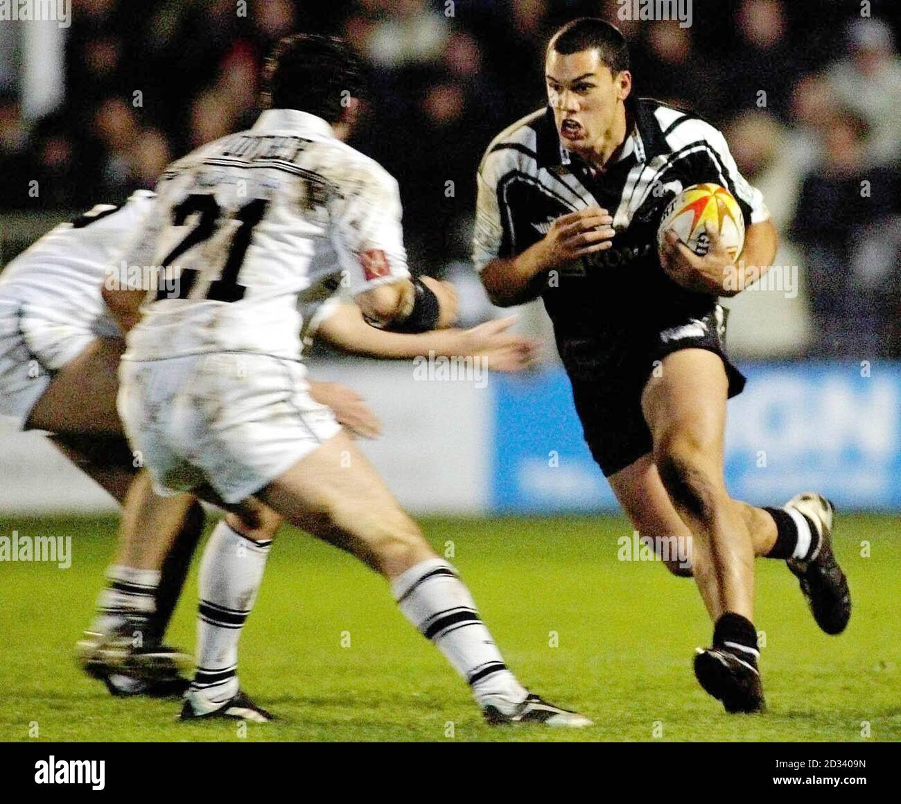 New Zealand's Lance Hohaia runs the ball in to Hull FC's Craig Poucher ...