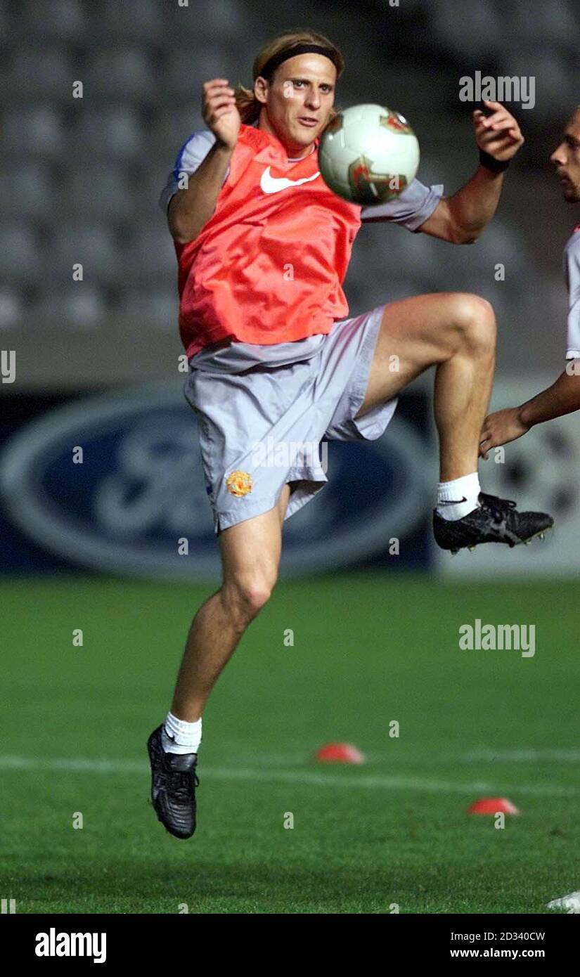 England's David Beckham stretches his left leg with physiotherapist ...