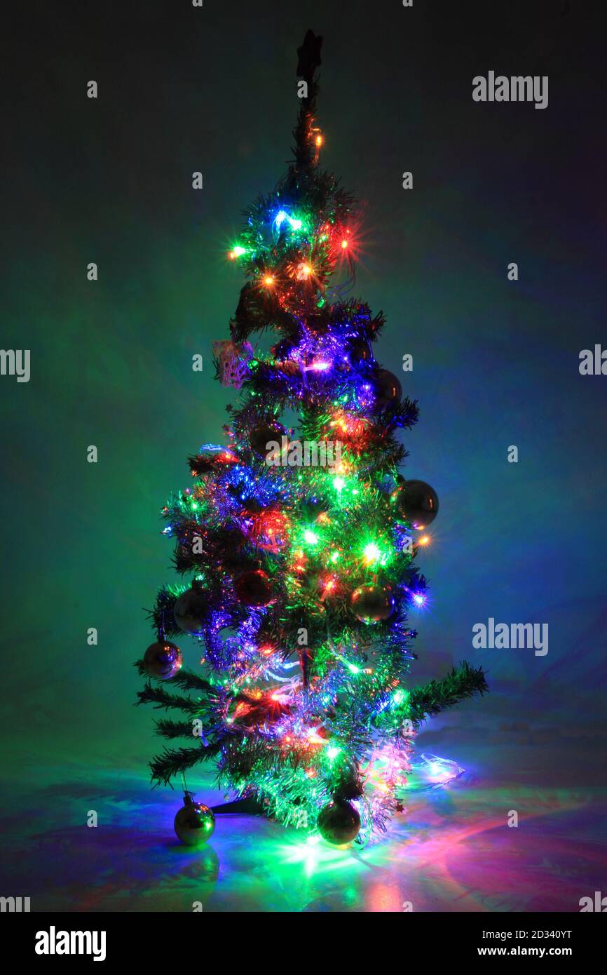 christmas tree from the color lights in the night Stock Photo - Alamy