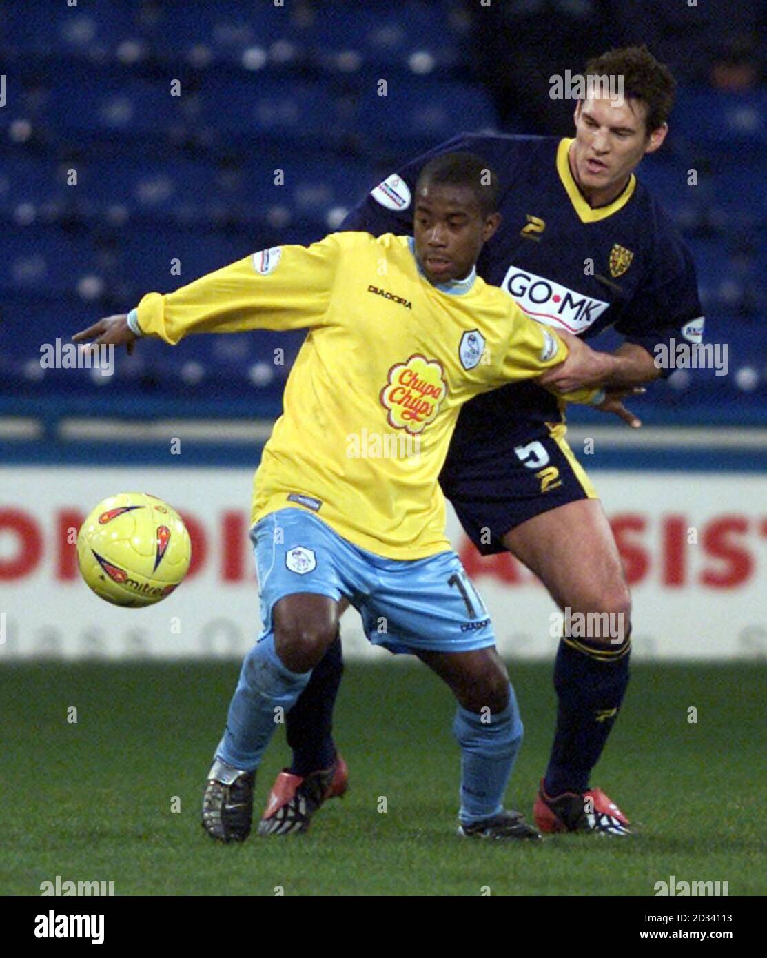 Sheffield wednesdays leon knight keeps ball wimbledons mark williams hi ...