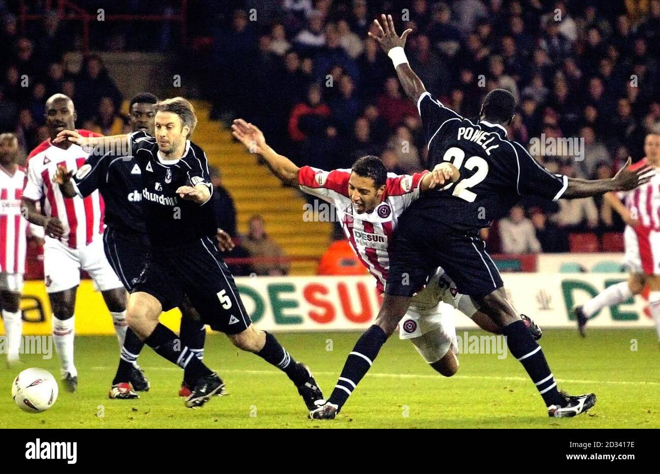 Sheffield United's Carl Asaba is tackled in the box by Crystal Palace's ...