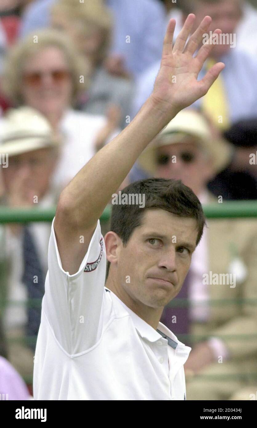 Great Britain's Tim Henman waves to the crowd after defeating Italian ...
