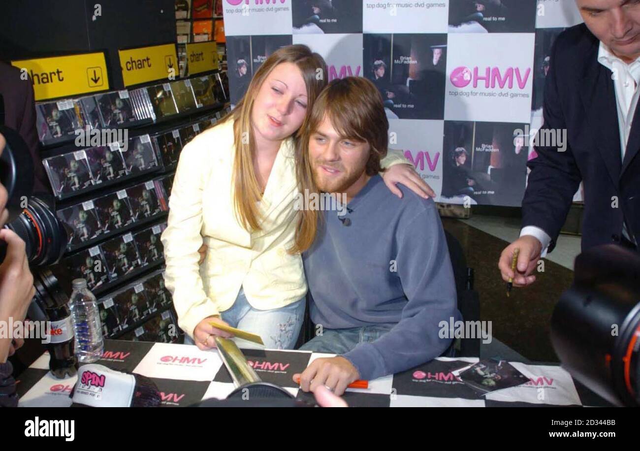 Ex westlife singer bryan mcfadden hugs hi-res stock photography and ...
