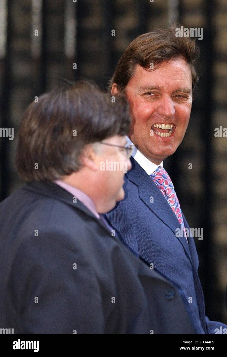 Labour's newly appointed 'election supremo' Alan Milburn (right) leaves ...