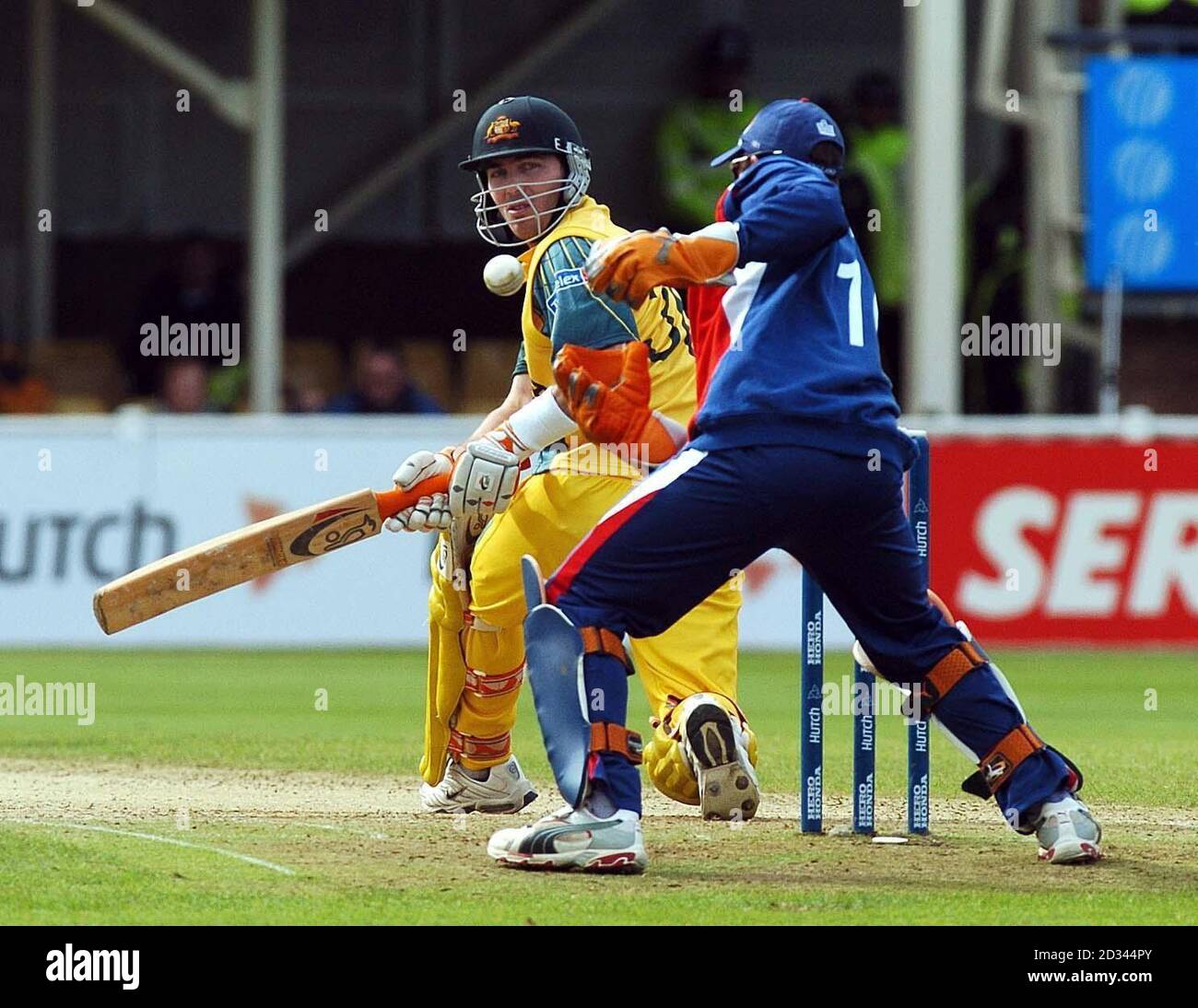Australia's Damien Martyn sweeps a ball from England's Ashley Giles ...