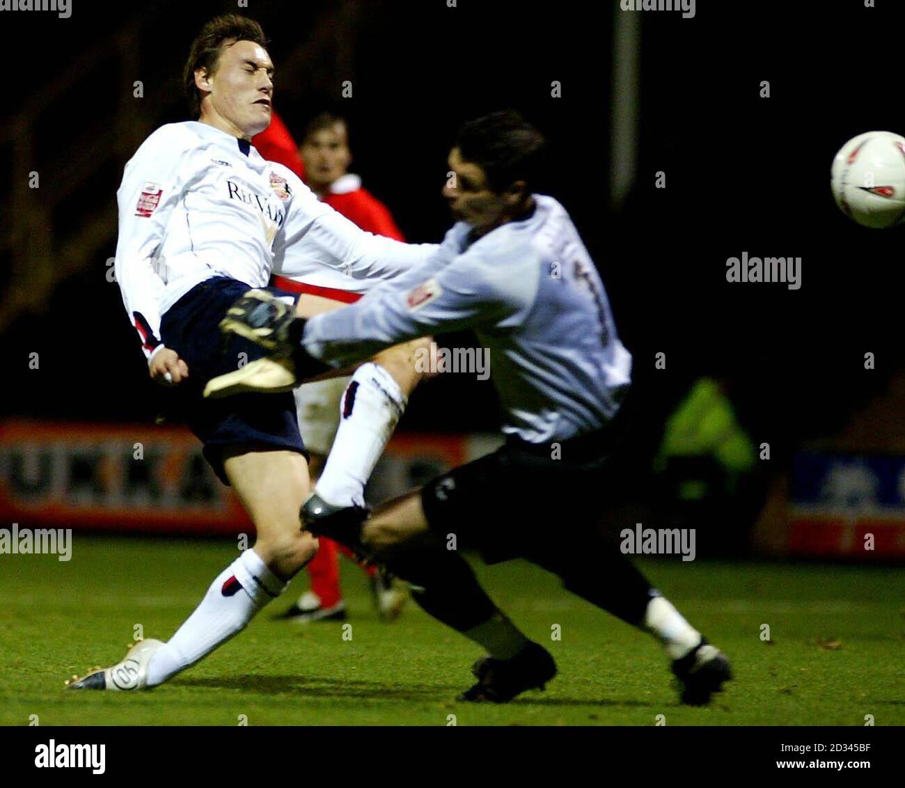 Sunderland's Dean Whitehean (left) manages to put the ball past ...