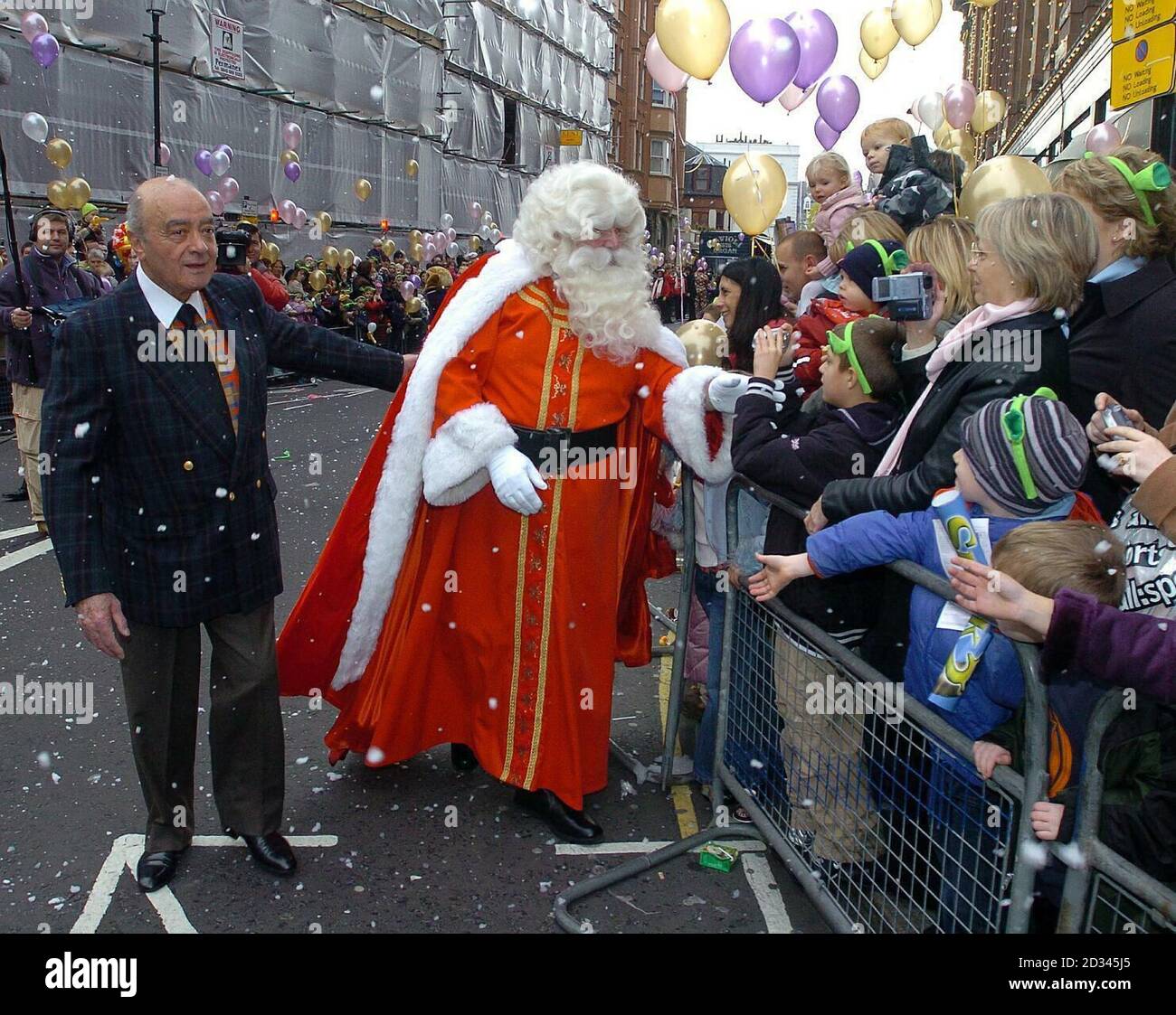 Harrods chairman Mohamed Al Fayed (left) and Father Christmas meet ...