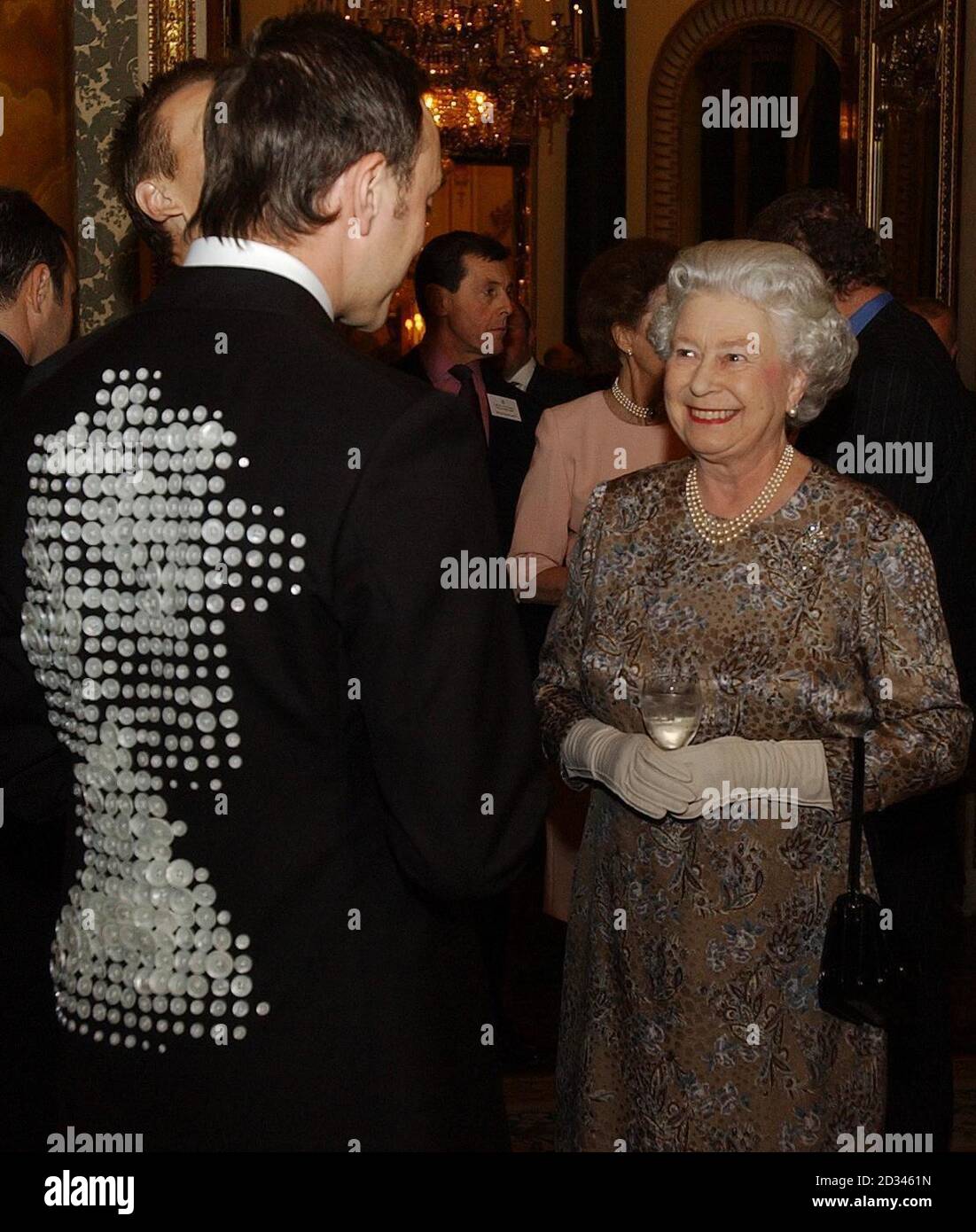 Britain's Queen Elizabeth II meets designer Simon Waterfall during a ...
