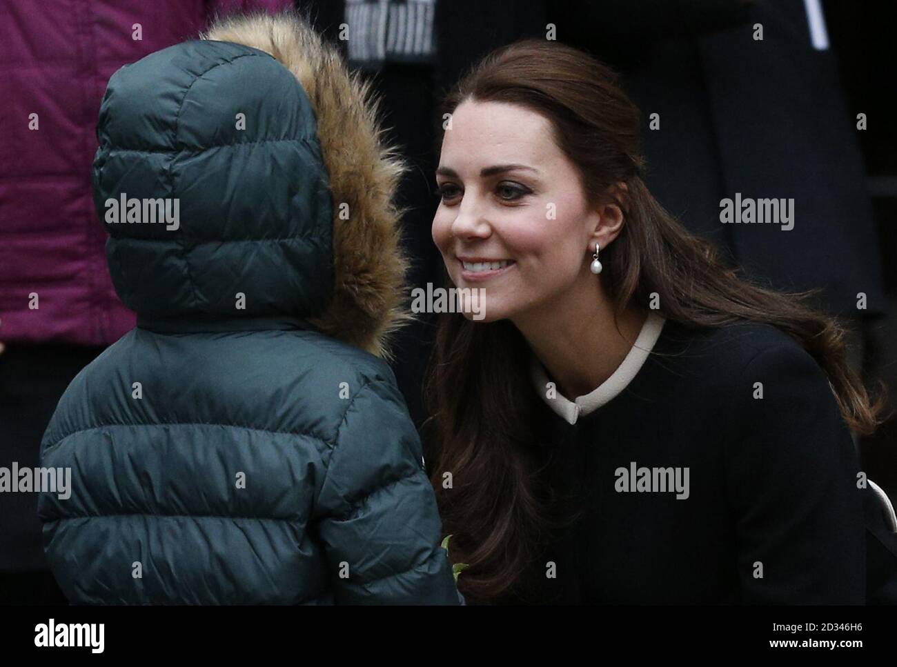 The Duchess of Cambridge greets the crowds outside as she leaves after ...