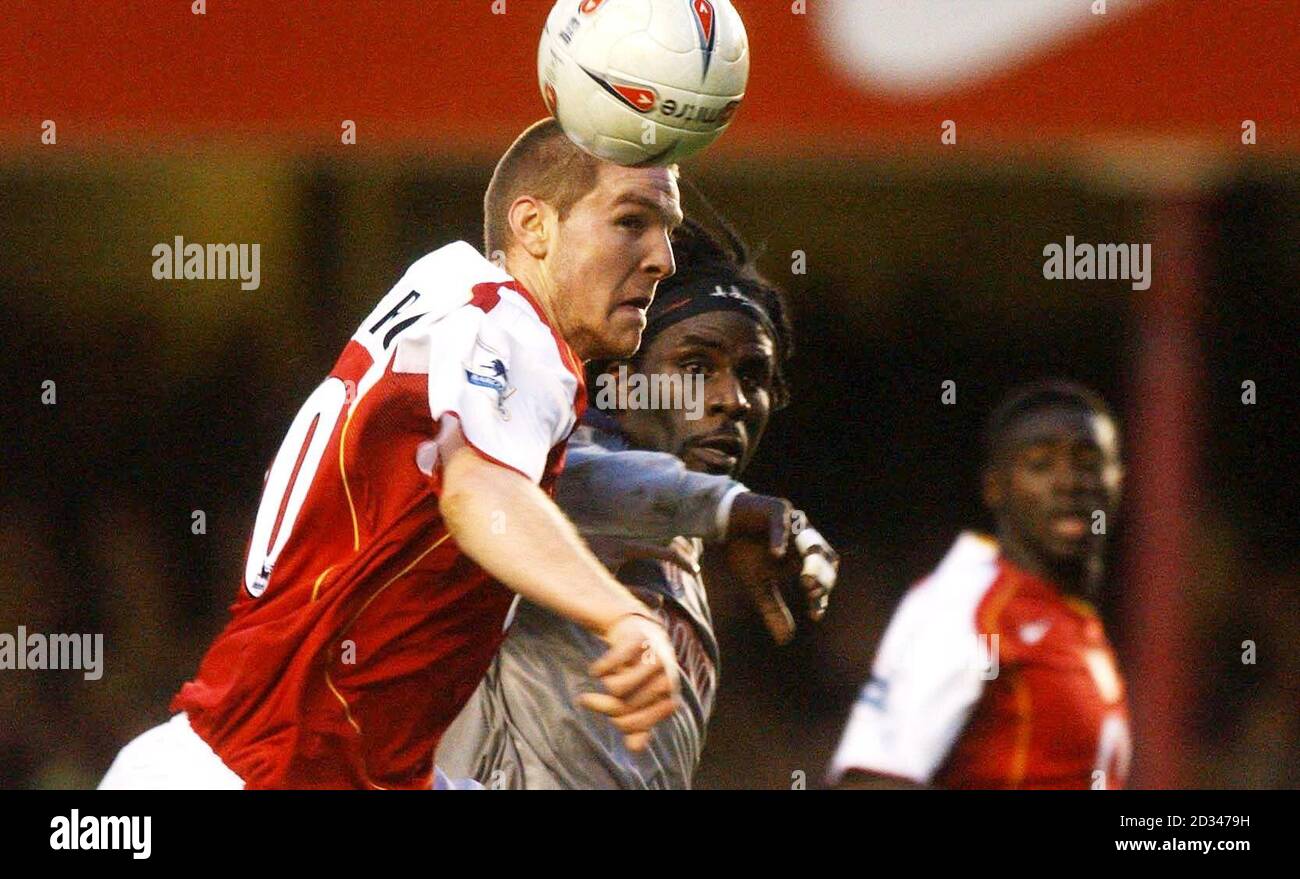Arsenal's Philippe Senderos (left) wins the header against Stoke's Ade ...