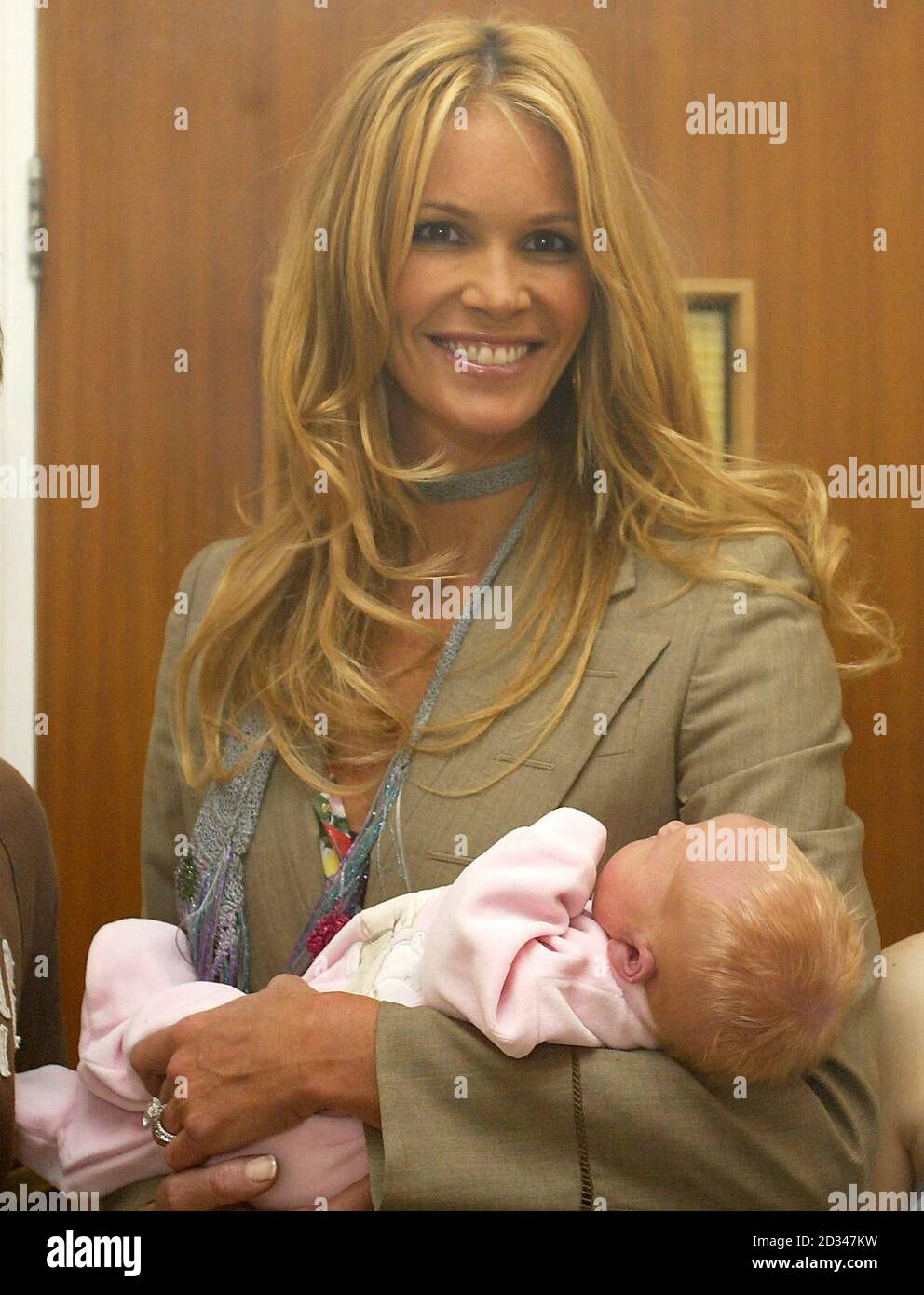 Supermodel Elle Macpherson holds baby Olivia during a visit to the ...