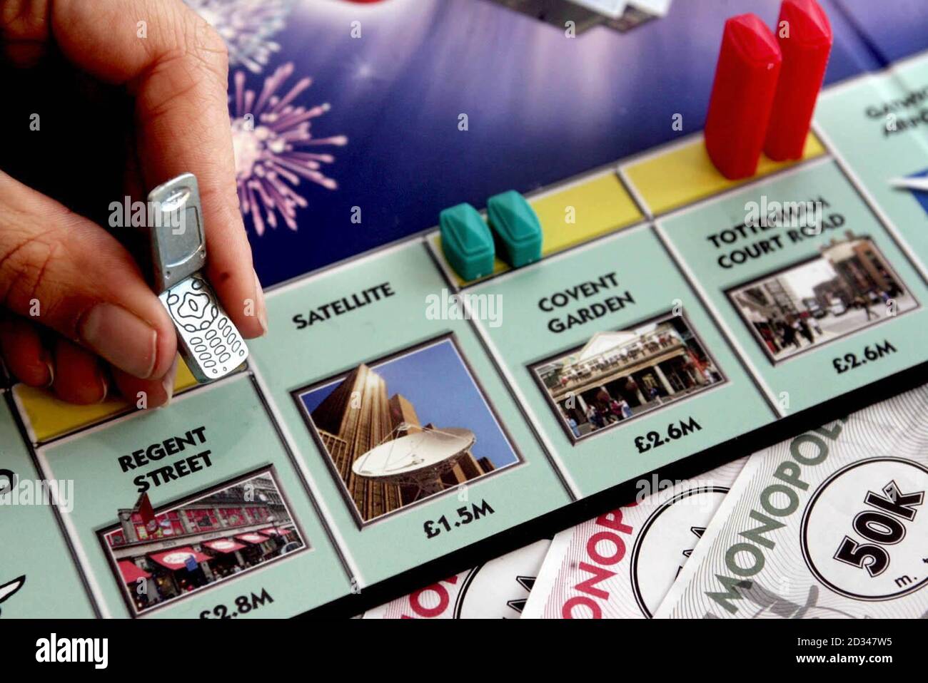 Playing monopoly phone hi-res stock photography and images - Alamy
