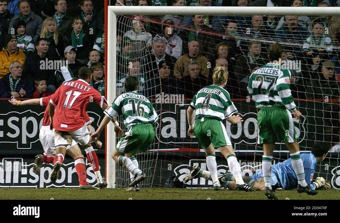 Charlton Athletic's Shaun Bartlett (L) beats Yeovil's goalkeeper Chris ...