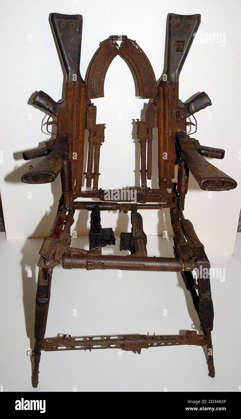 This dramatic sculpture is fashioned out of AK47's and Kalashnikovs ...