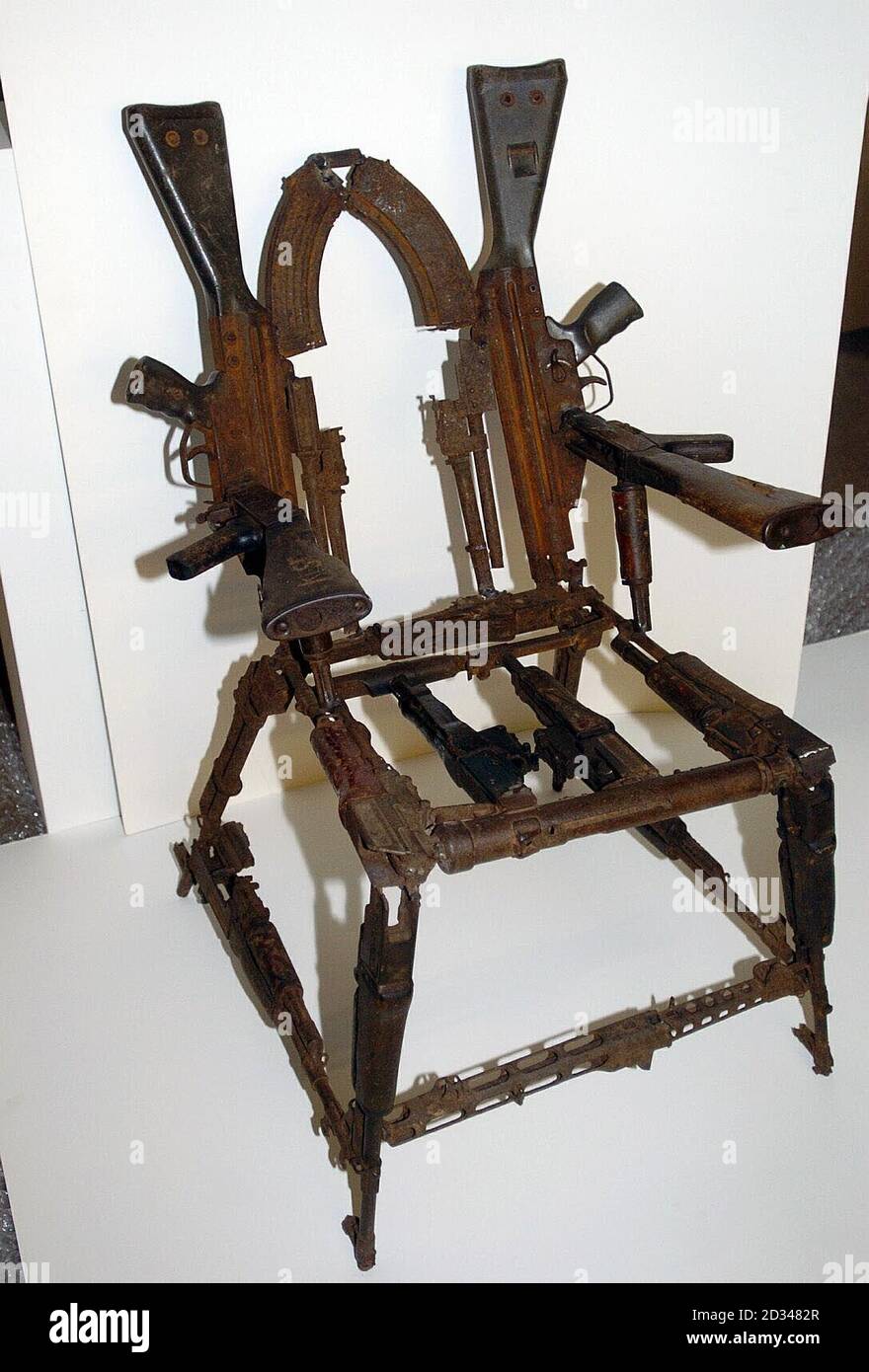 This dramatic sculpture is fashioned out of AK47's and Kalashnikovs ...