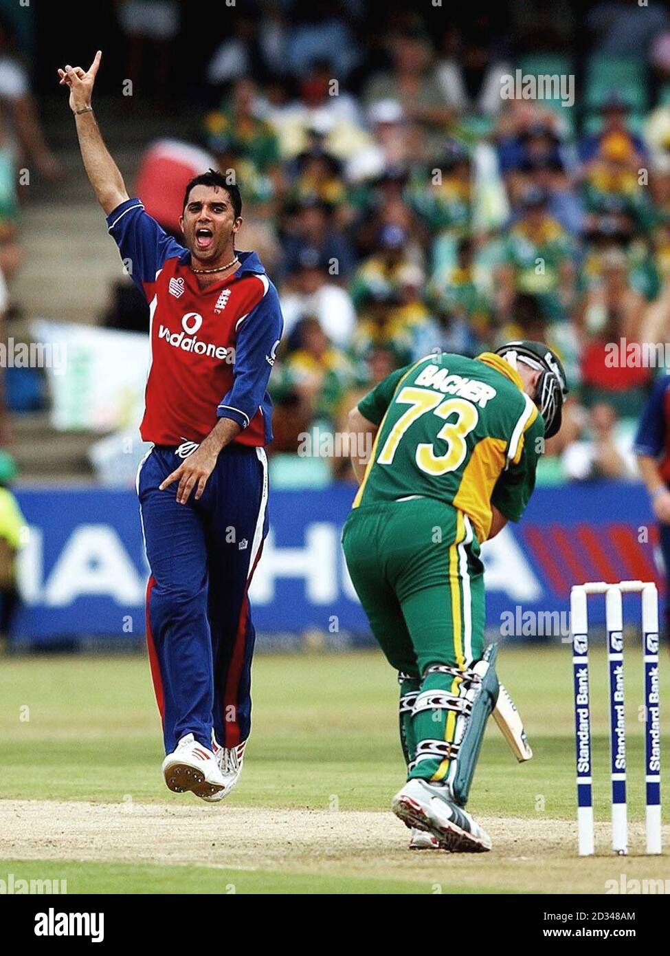 England's Kabir Ali (L) celebrates trapping South Africa's Adam Bacher ...